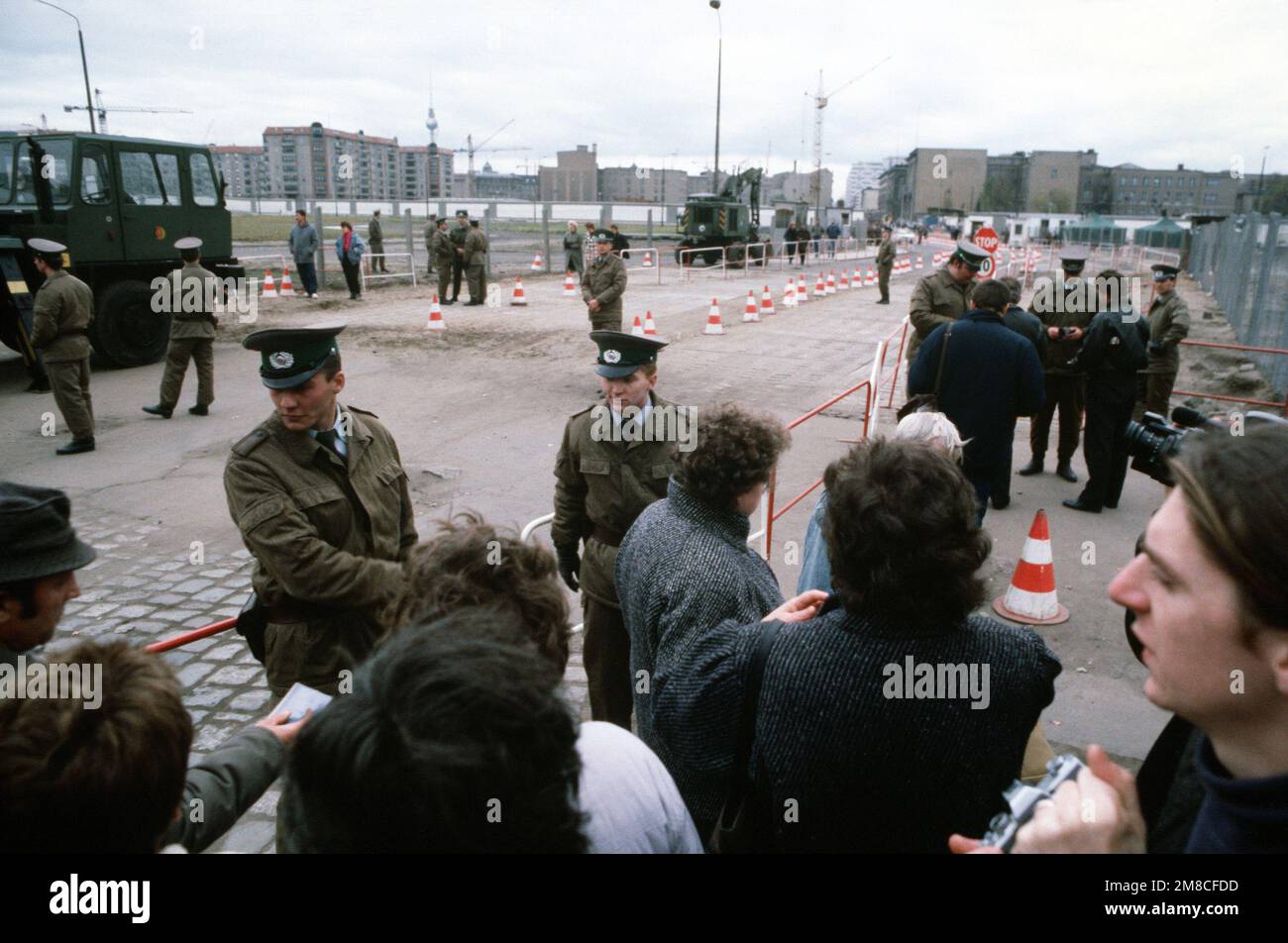 East German police monitor people returning to East Berlin through the ...