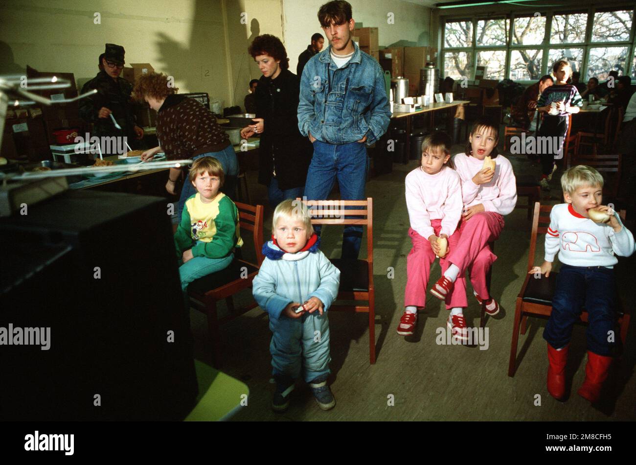 East German children enjoy a snack at the refugee center in West Berlin ...