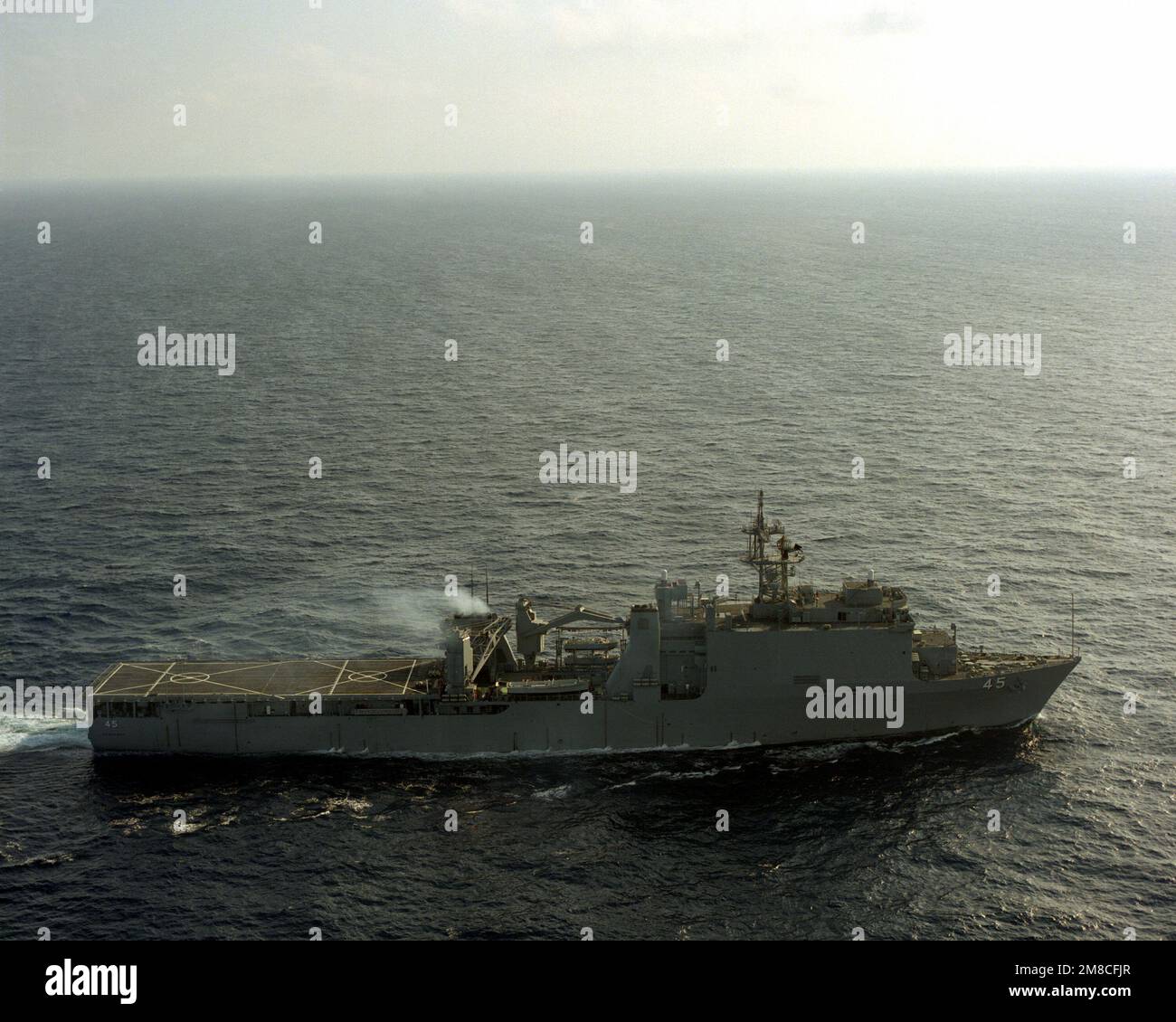 An elevated starboard beam view of the dock landing ship COMSTOCK (LSD ...