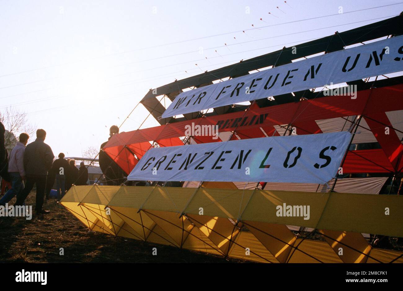 A large kite bearing the shared colors of the East and West German ...