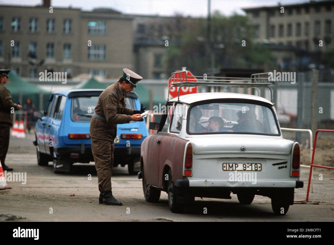 An East German policeman monitors traffic returning to East Berlin ...