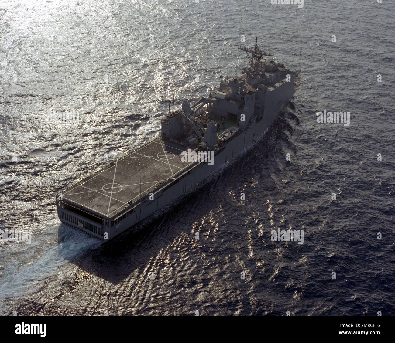An elevated starboard quarter view of the dock landing ship COMSTOCK ...