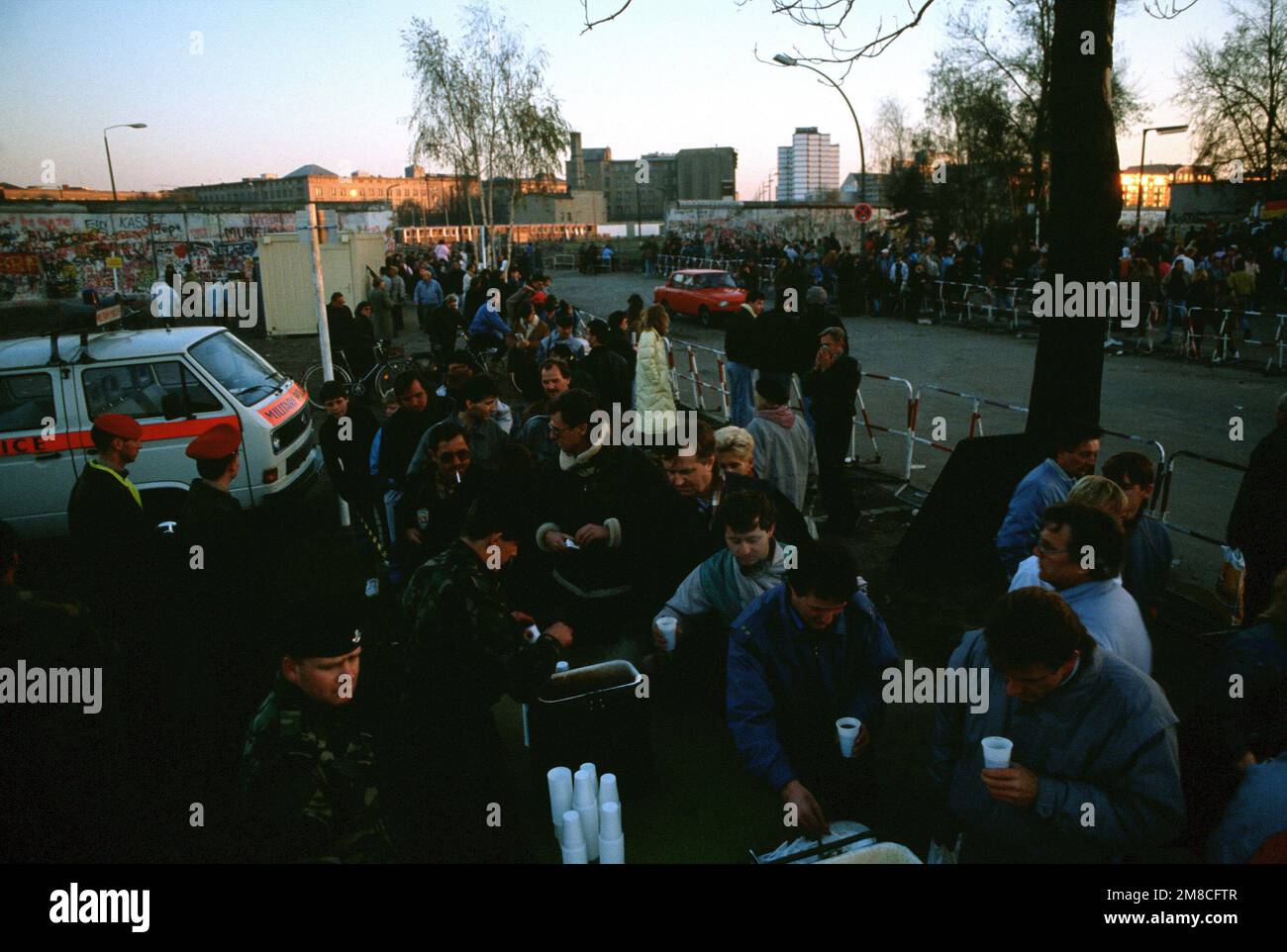 Visitors stand in line for refreshments as they gather at the newly ...