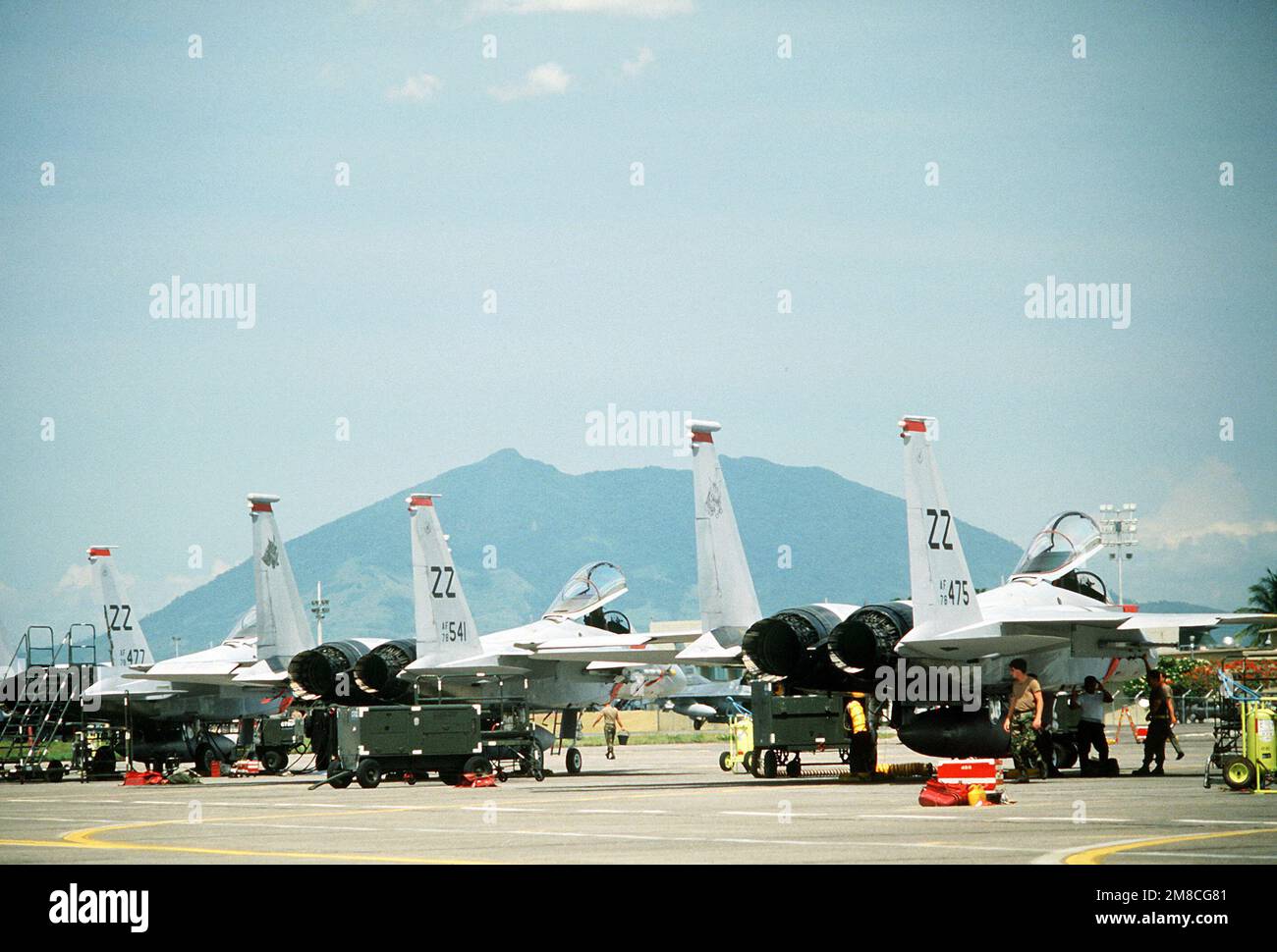 Ground crewmen perform maintenance on three 18th Tactical Fighter Wing ...