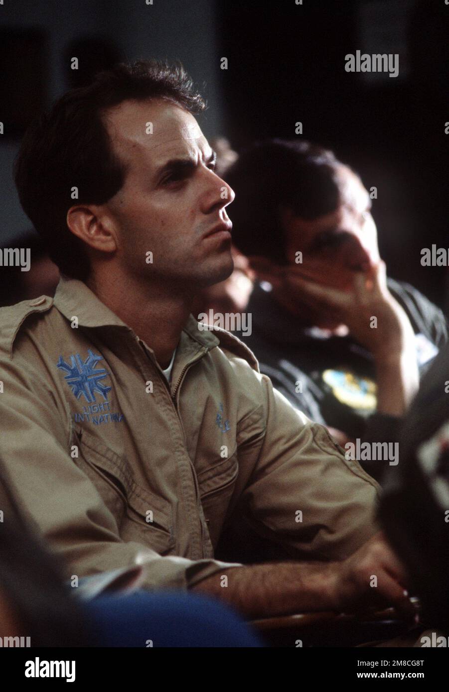 A civilian pilot from Flight International Corporation (FIC) sits in on ...
