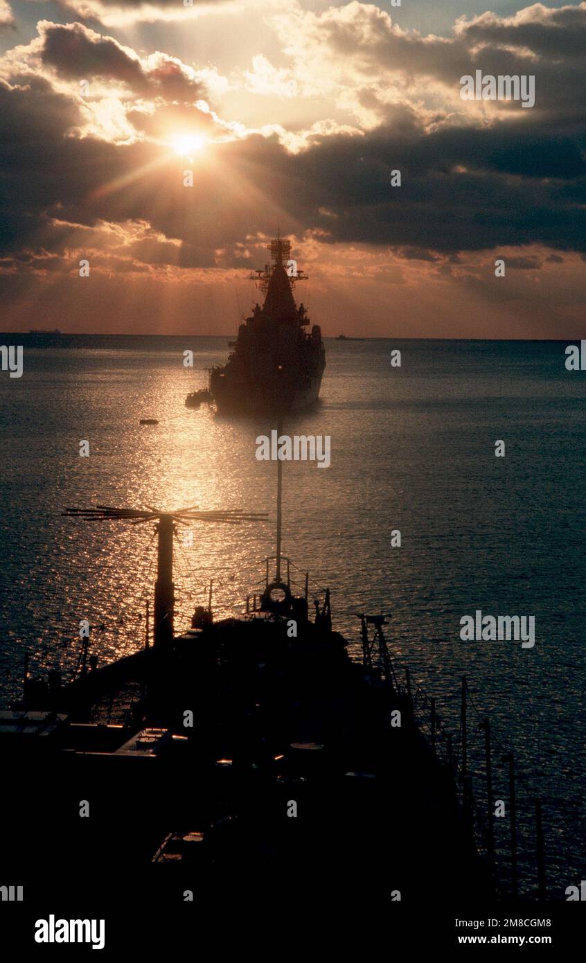 A view of the Soviet guided missile cruiser SLAVA silhouetted by the ...