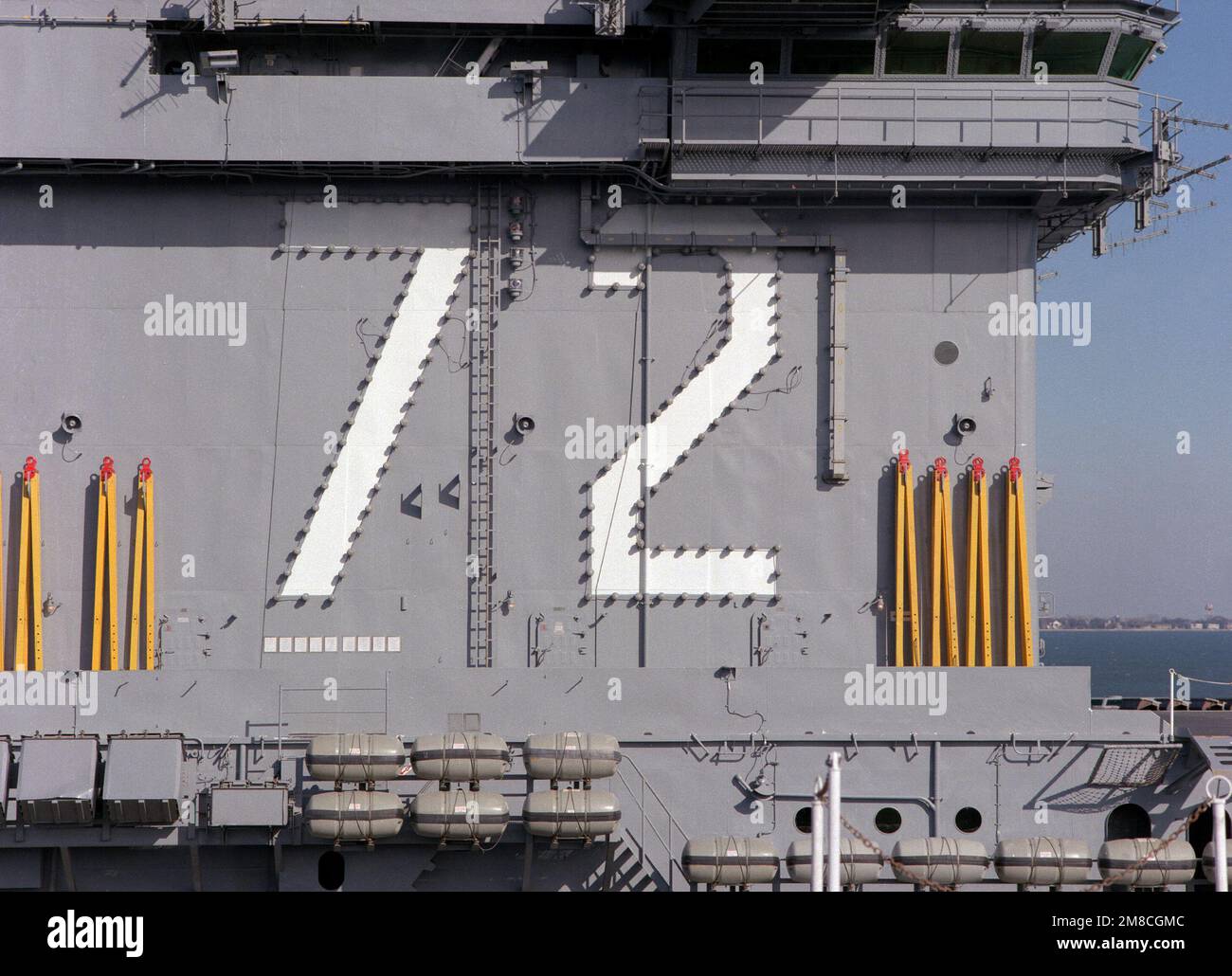 A close-up view of the starboard side of the island structure aboard ...