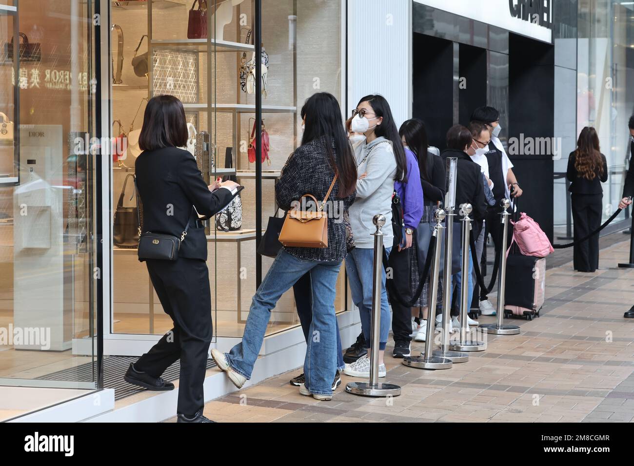 Shoppers form a line at the Ocean Centre shopping mall on Canton RoaD ...