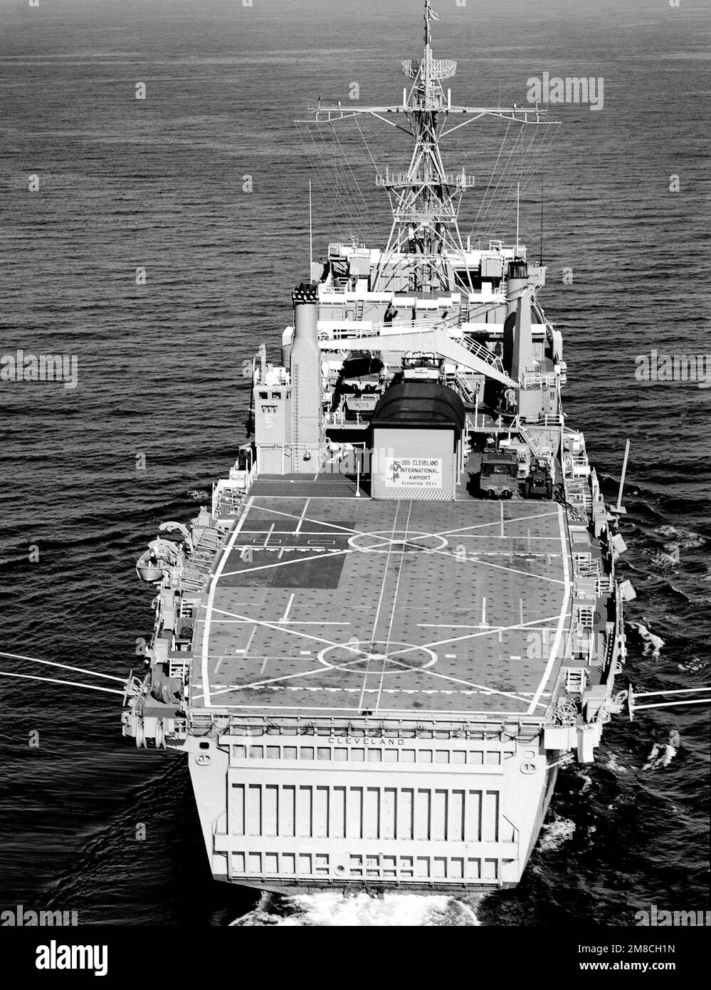 A stern view of the amphibious transport dock USS CLEVELAND (LPD 7 ...