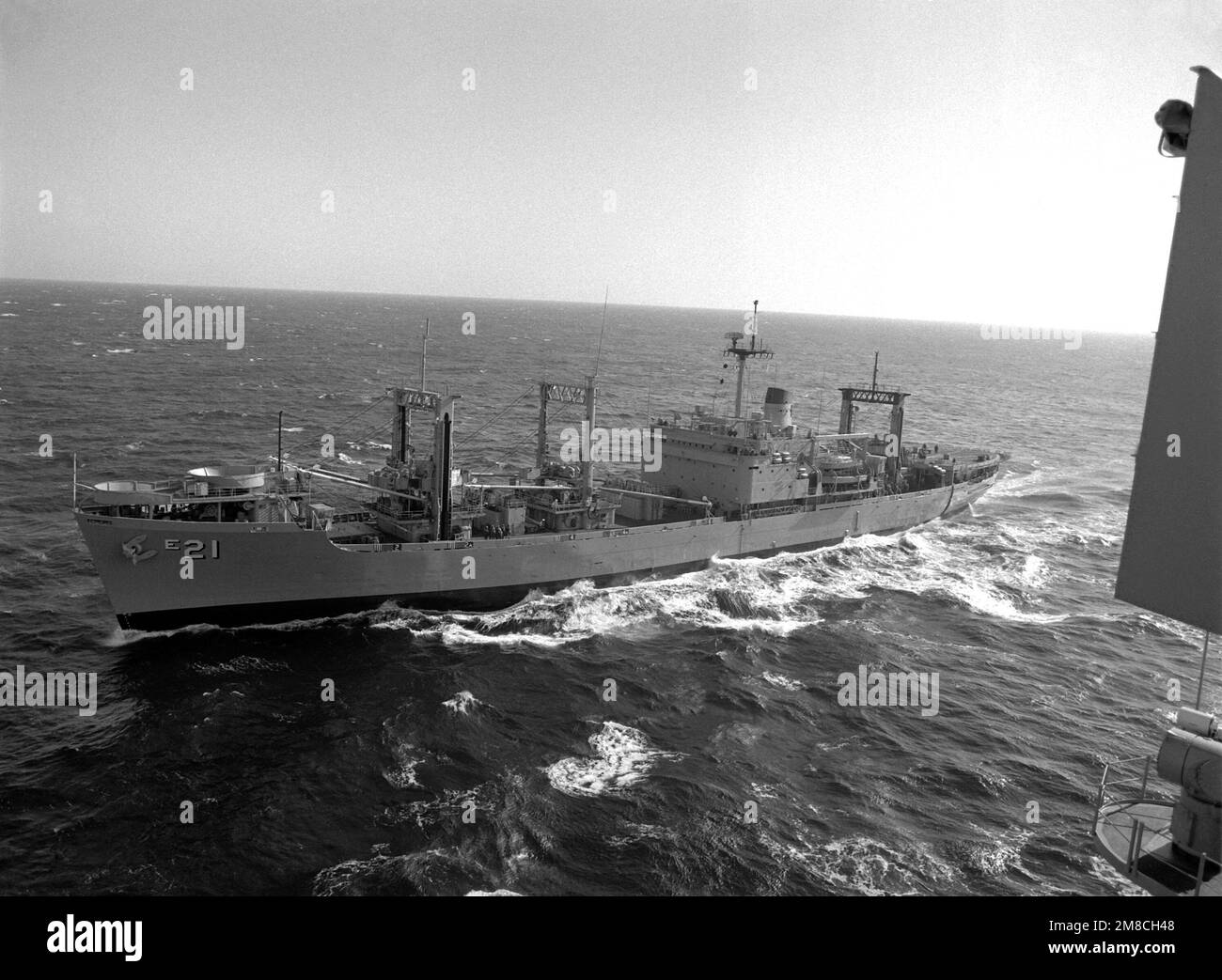 A port bow view of the ammunition ship USS SURIBACHI (AE-21) coming alongside the nuclear ...