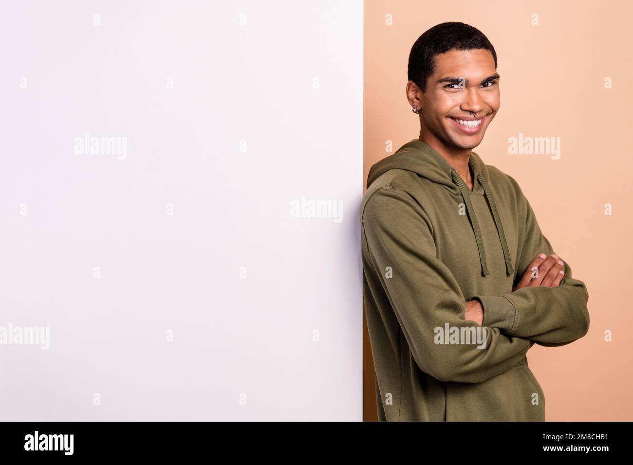 Photo of cheerful successful man wear khaki stylish clothes arm crossed ...