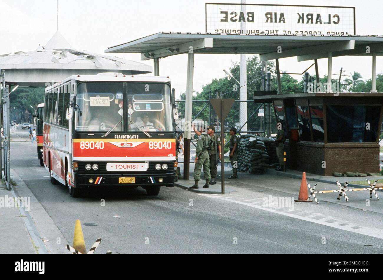 A civilian bus is checked over before being allowed to enter the front ...