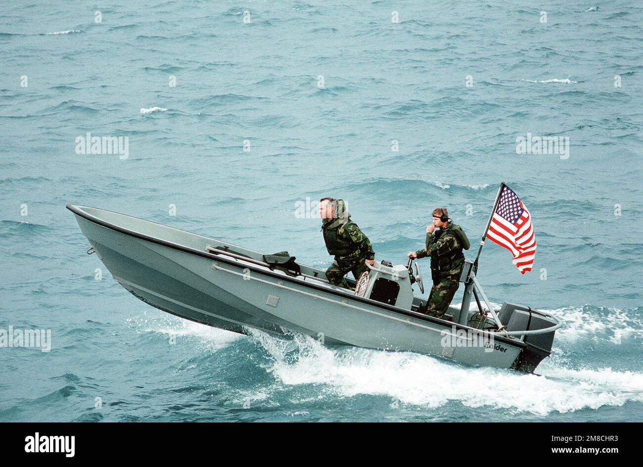 US Navy explosive ordnance disposal (EOD) personnel ride through the ...