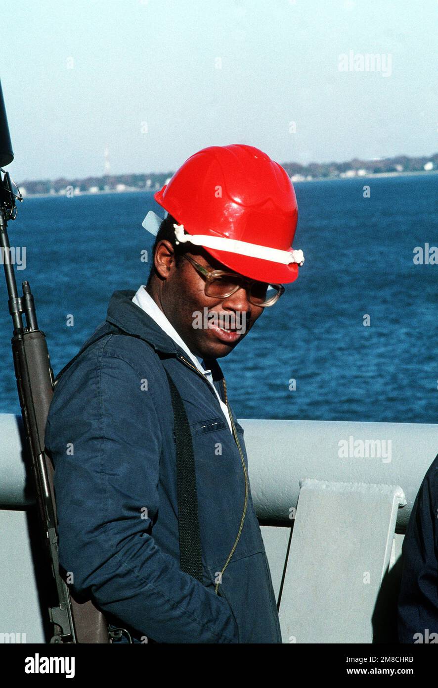 GUNNER's Mate G (Guns) 2nd Class Page stands by with an M14 7.62 mm ...
