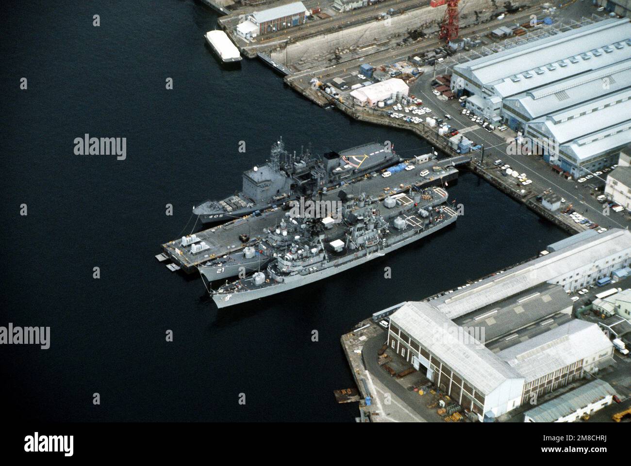An aerial view of docked military vessels. Left to right: The Japanese ...