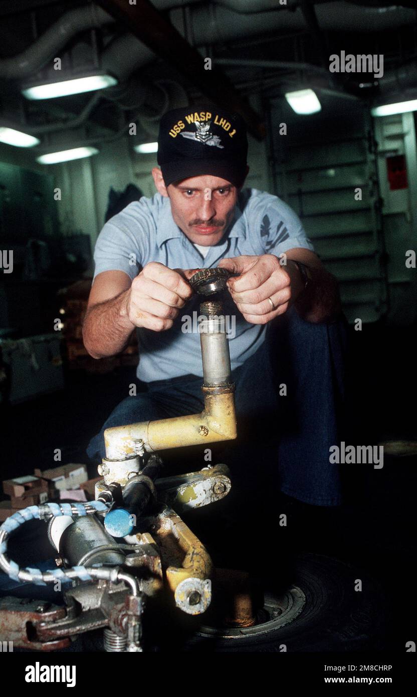 Aviation Support Equipment Technician 1ST Class Butler positions a ...