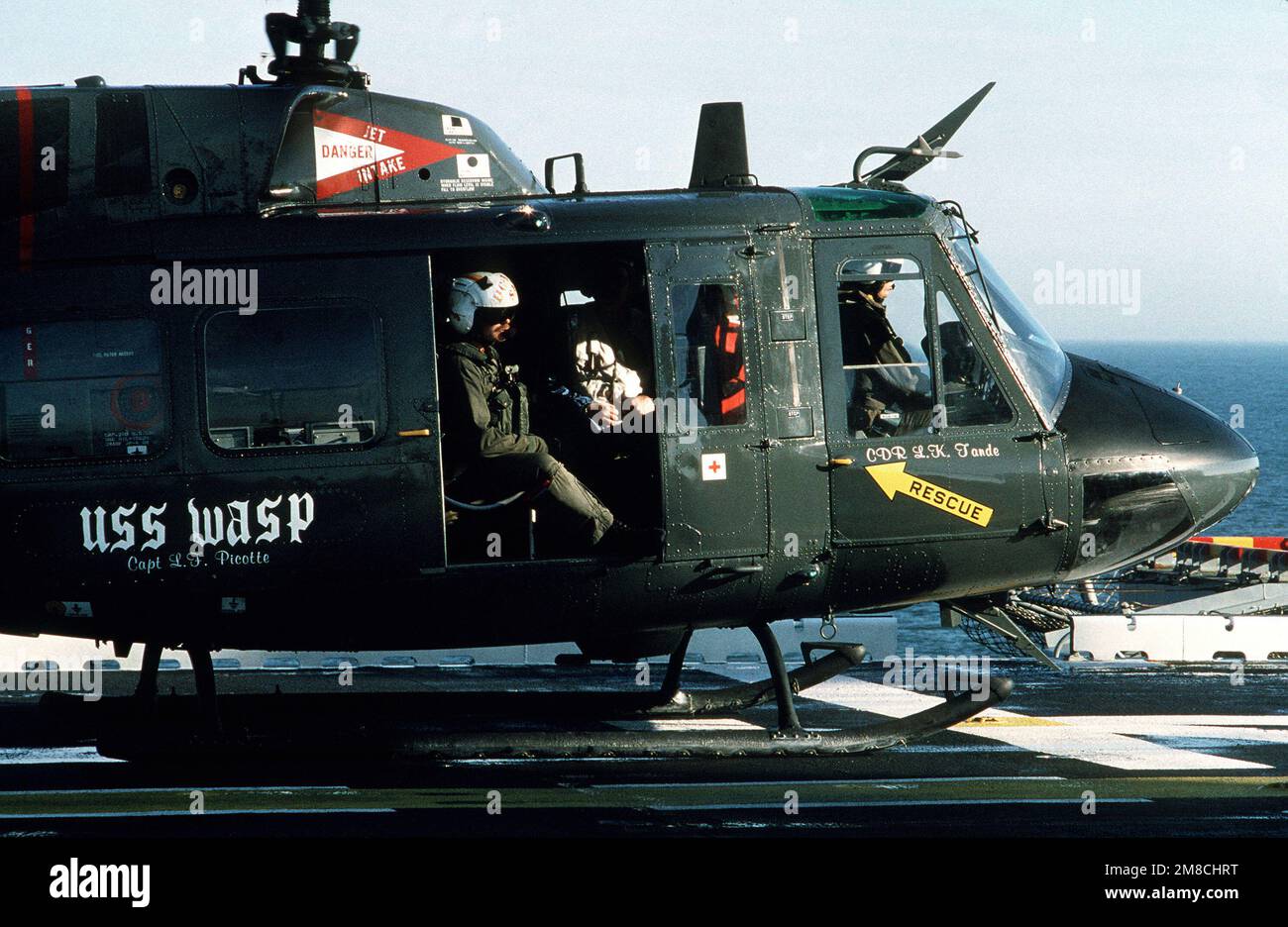 A UH-1 Iroquois helicopter, nicknamed Stinger 1, prepares to take off ...