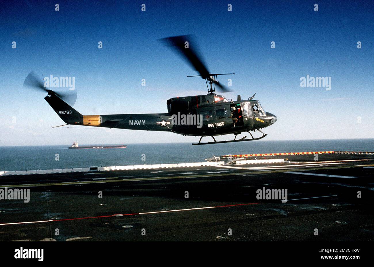 A UH-1 Iroquois helicopter, nicknamed Stinger 1, take off from the ...