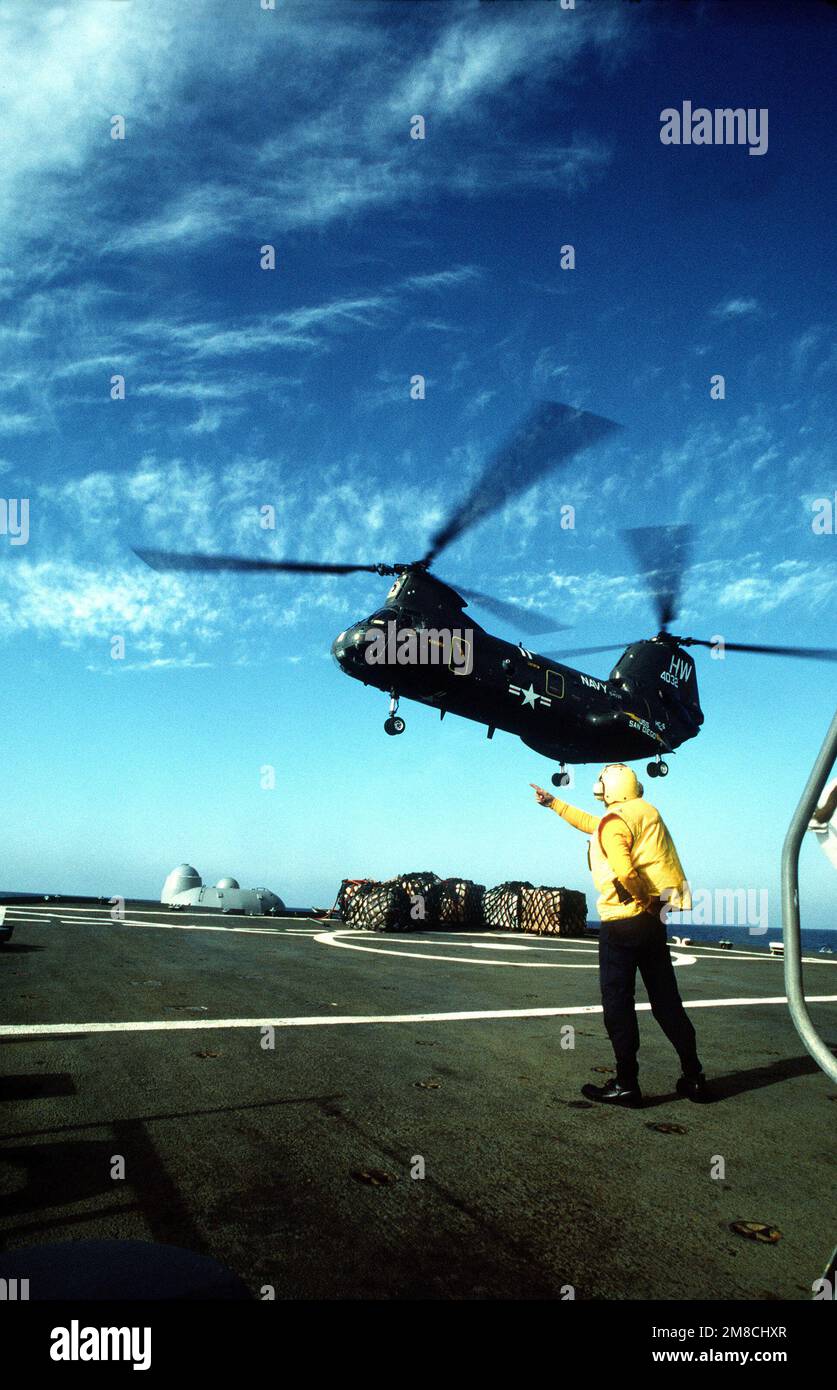 A plane director aboard the guided missile cruiser USS BELKNAP (CG 26 ...