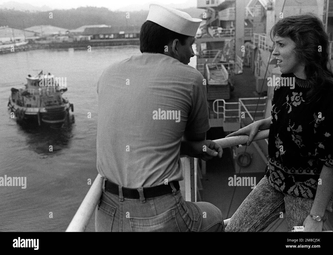 SEAMAN Apprentice Allen Sanders and his wife Michelle talk as they wait ...