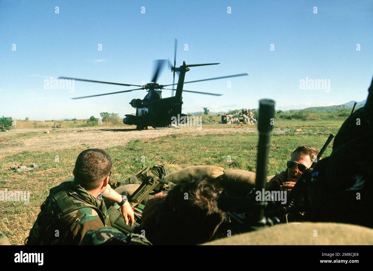 A Marine Corps CH-53D Sea Stallion helicopter idles in a landing zone ...