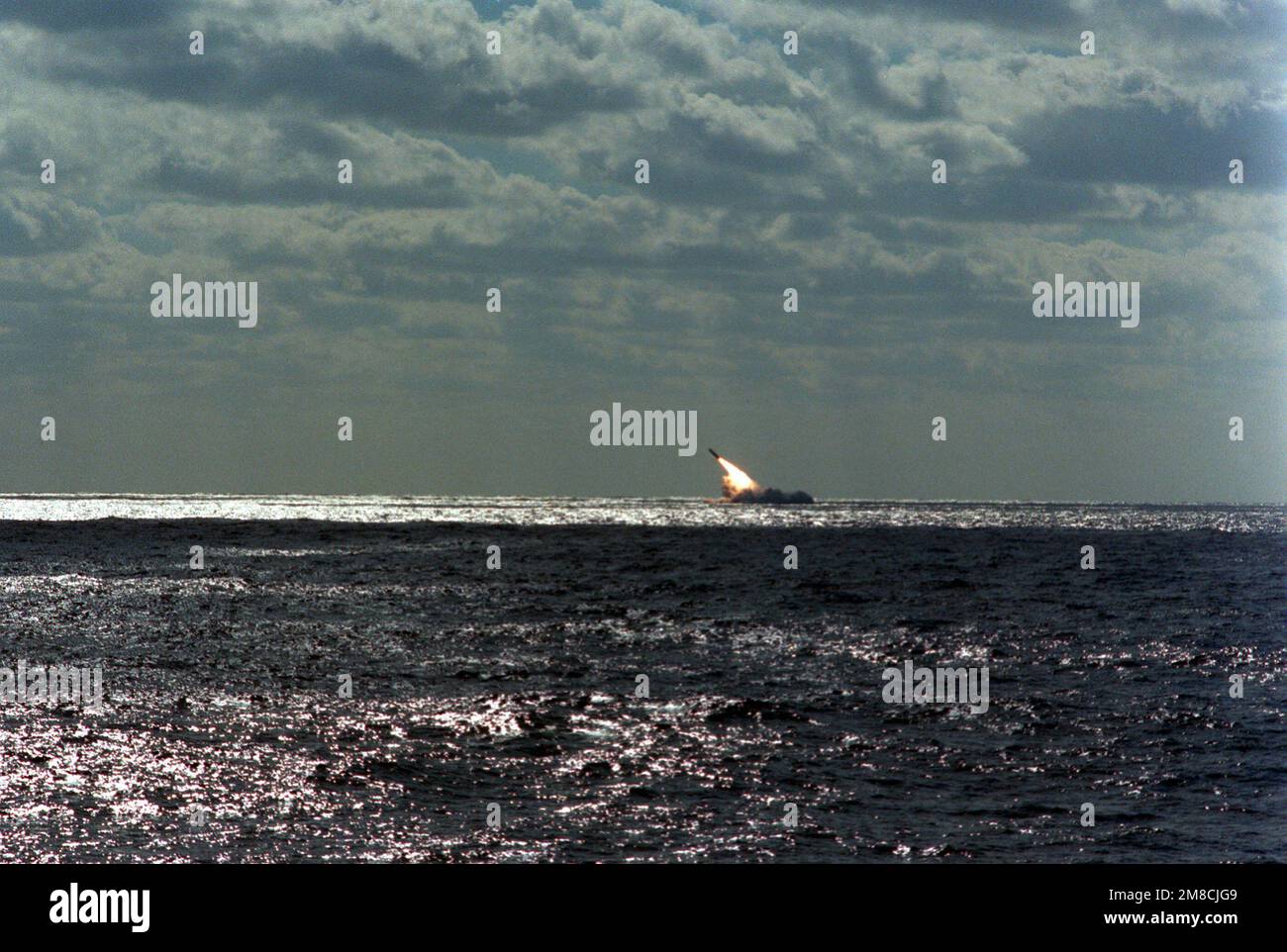 A Trident II D-5 intercontinental ballistic missile emerges from the ...