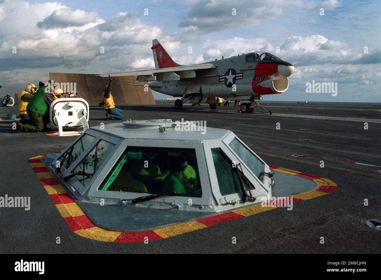 Catapult crew members prepare to launch an A-7 Corsair II aircraft from ...