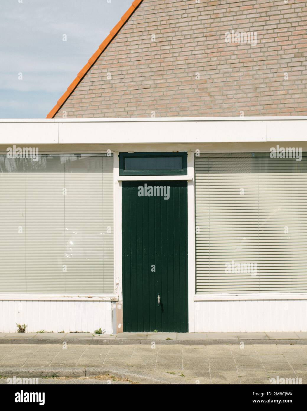 A minimalist dark green door in a modern building Stock Photo - Alamy