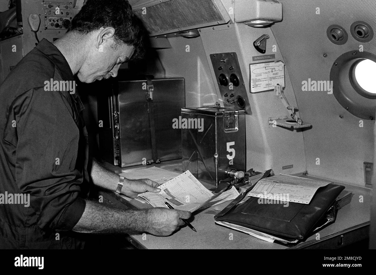 A member of the crew of a Naval Air Reserve Patrol Squadron 64 (VP-64 ...