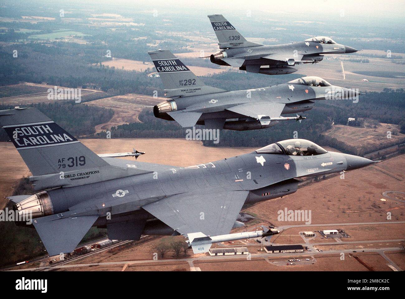 An air-to-air right side view of three 169th Tactical Fighter Group F ...