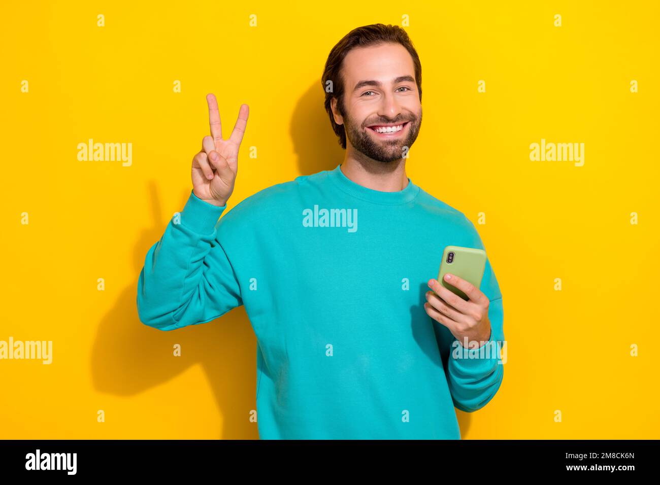 Photo of cheerful smiling friendly brunet hair guy wear blue jumper ...