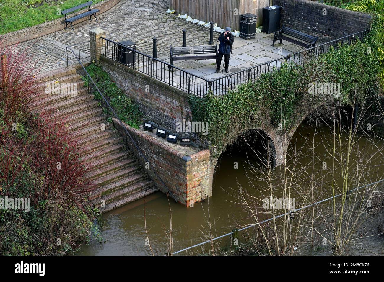 A photographer takes pictures of the swollen River Severn, as flood ...
