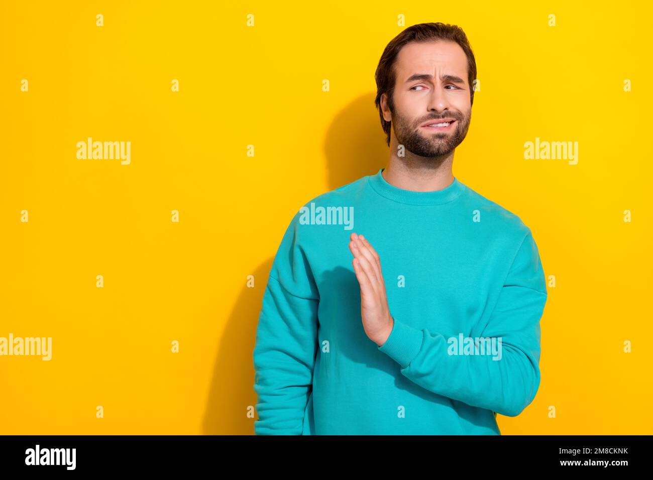 Photo of doubtful moody guy dressed teal outfit rising hand arm saying ...