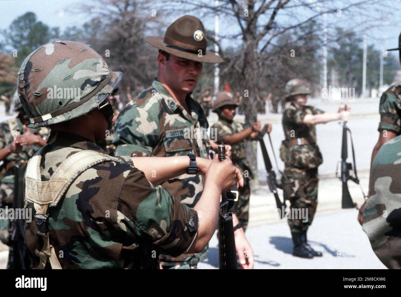 Female recruits practice the manual of arms during basic training. Base ...