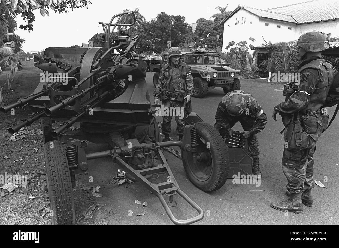 Three 5th Infantry Division (Mechanized) soldiers inspect a Soviet-made ...