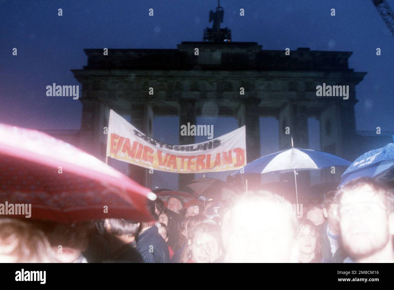 Crowds throng around the Brandenburg Gate following the structure's ...