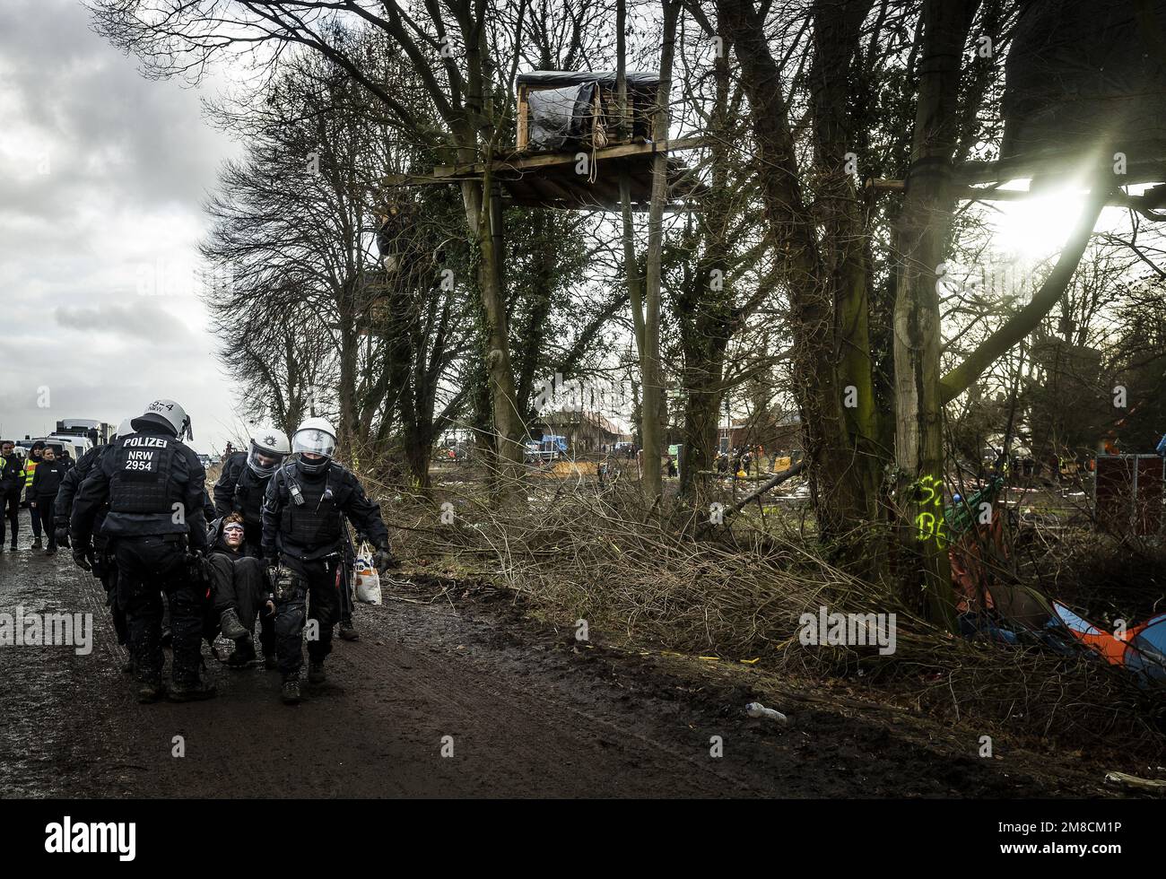 LUTZERATH - A climate activist is taken away by the police. Lutzerath ...