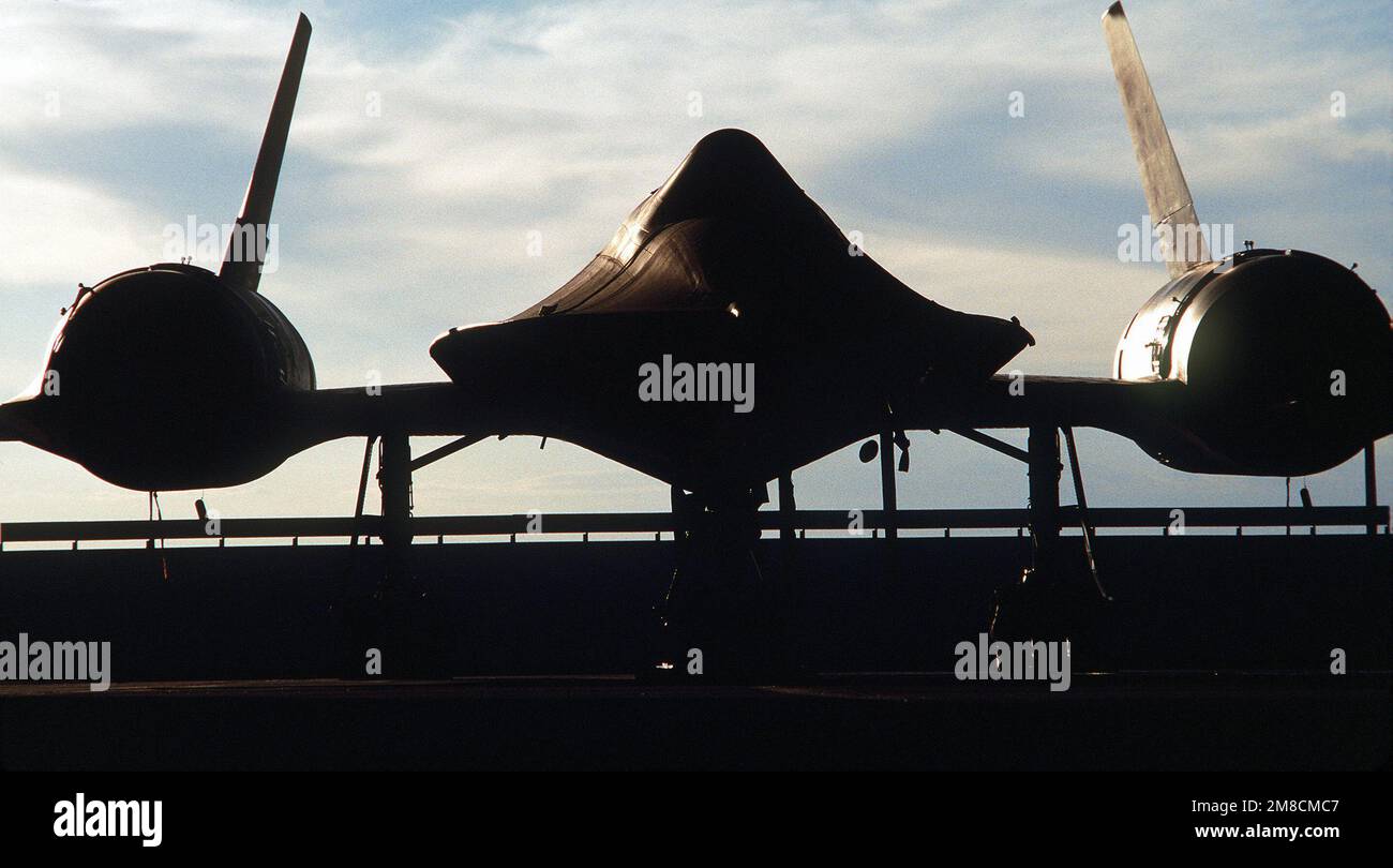 Silhouette, at dusk, of a 9th Strategic Reconnaissance Wing's SR-71 ...