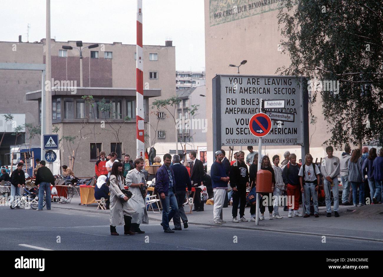 Curiosity seekers gather at the former Checkpoint Charlie following ...