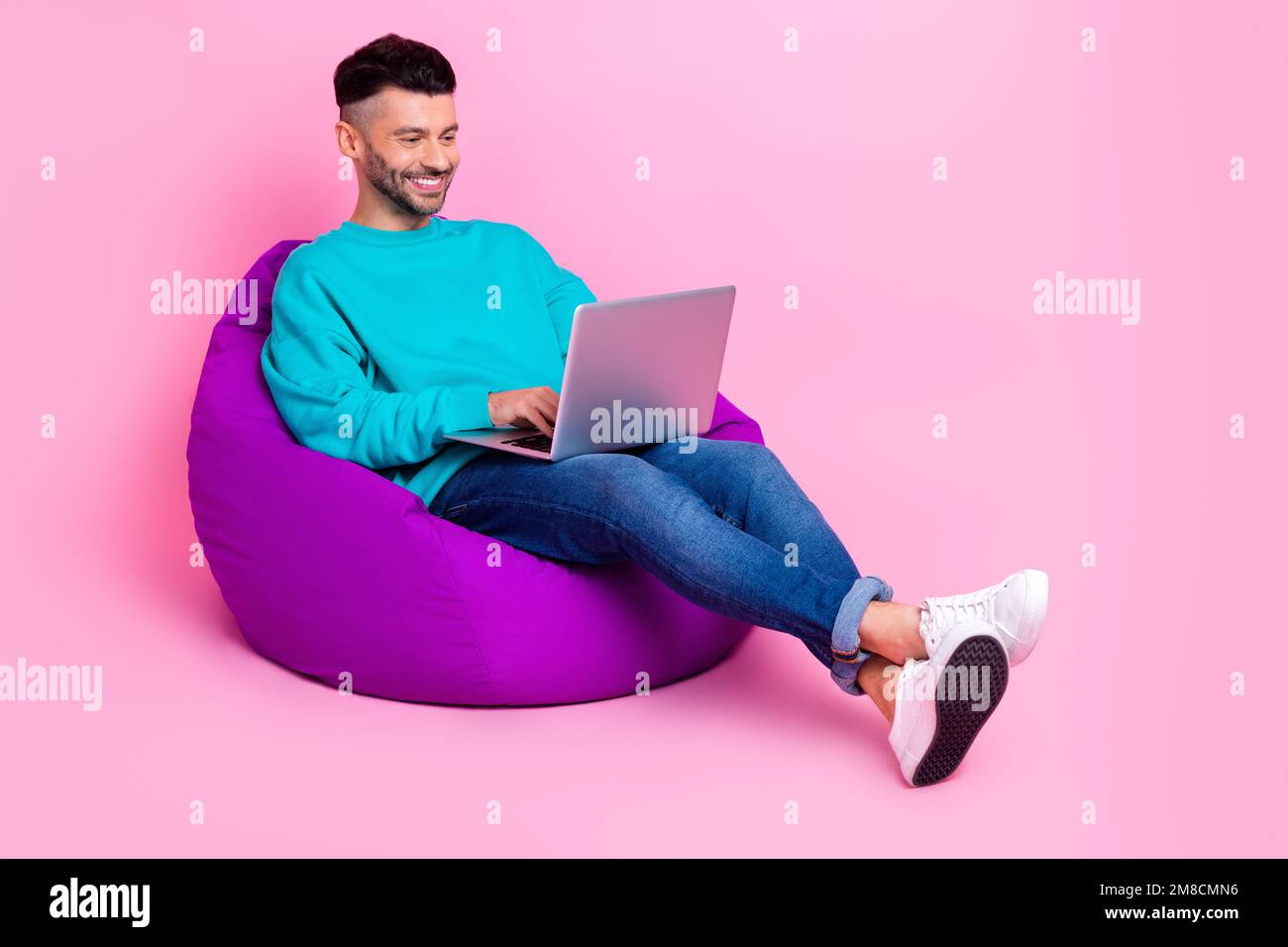 Full body photo of young attractive guy sit bean bag focused marketer ...