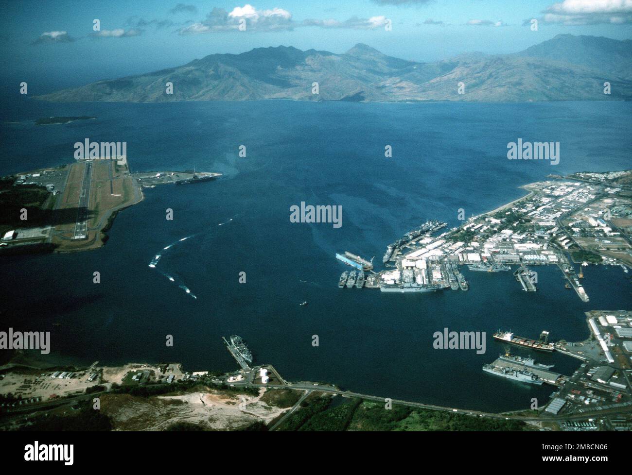 An aerial view of the station and, to the left, Naval Air Station, Cubi ...
