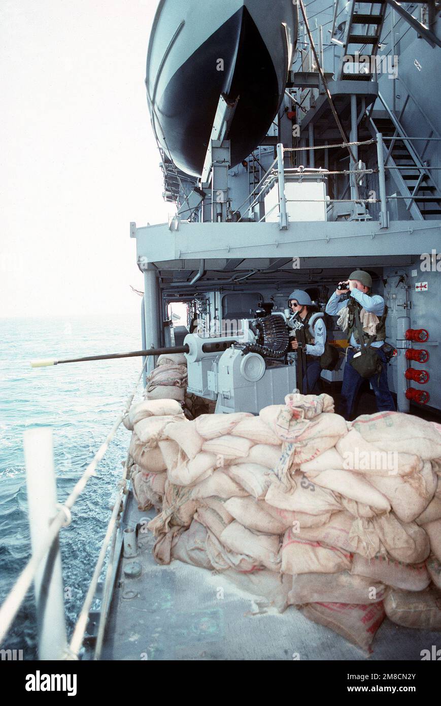 Sonar Technician G (Surface) 2nd Class Robert Johnson mans a Mark 38 ...