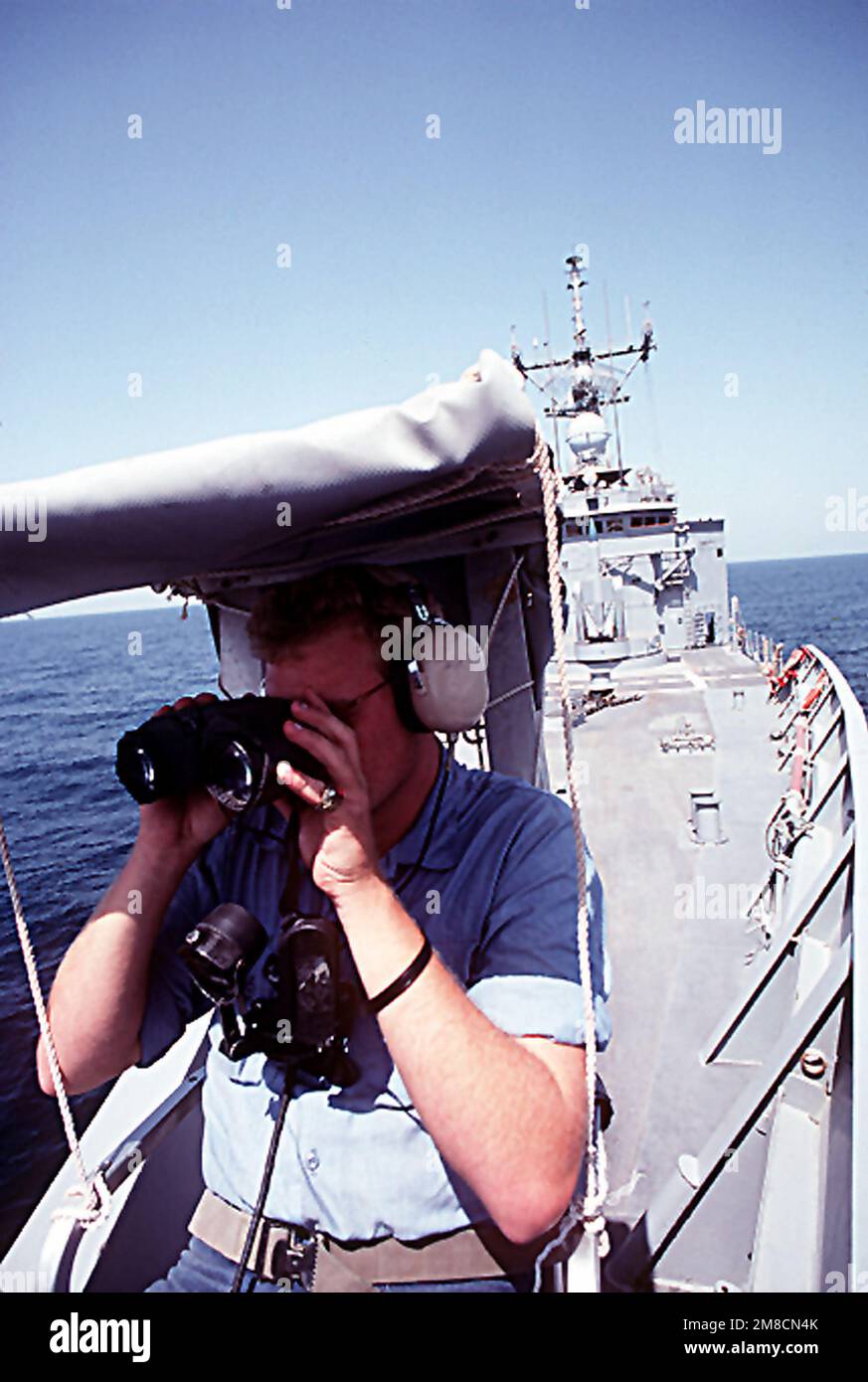 A sailor on the bow of the guided missile frigate USS ROBERT G. BRADLEY ...