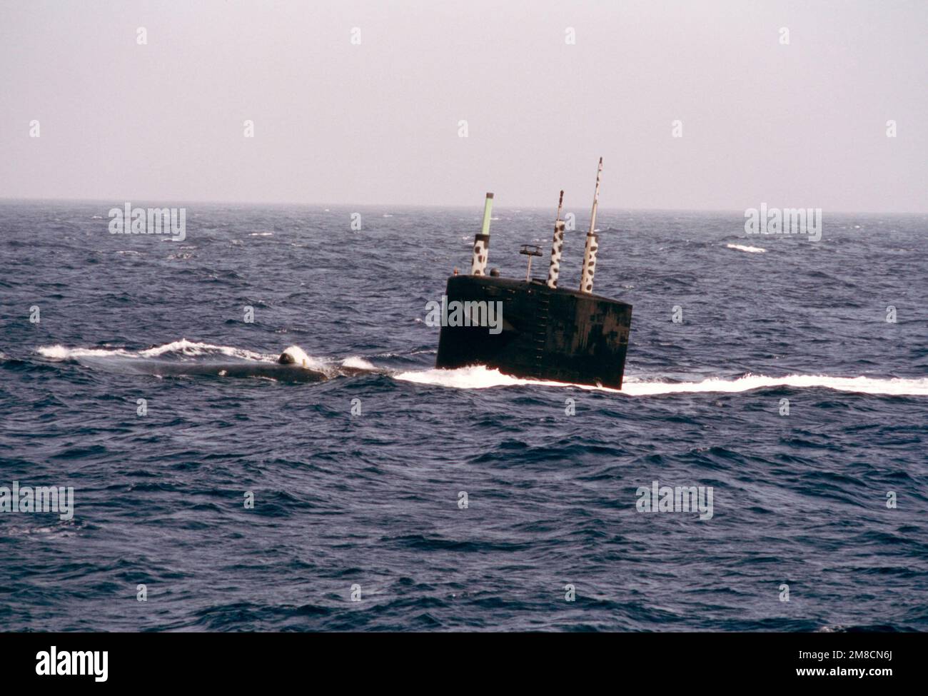 The nuclear-powered attack submarine USS GREENLING (SSN 614) travels on ...