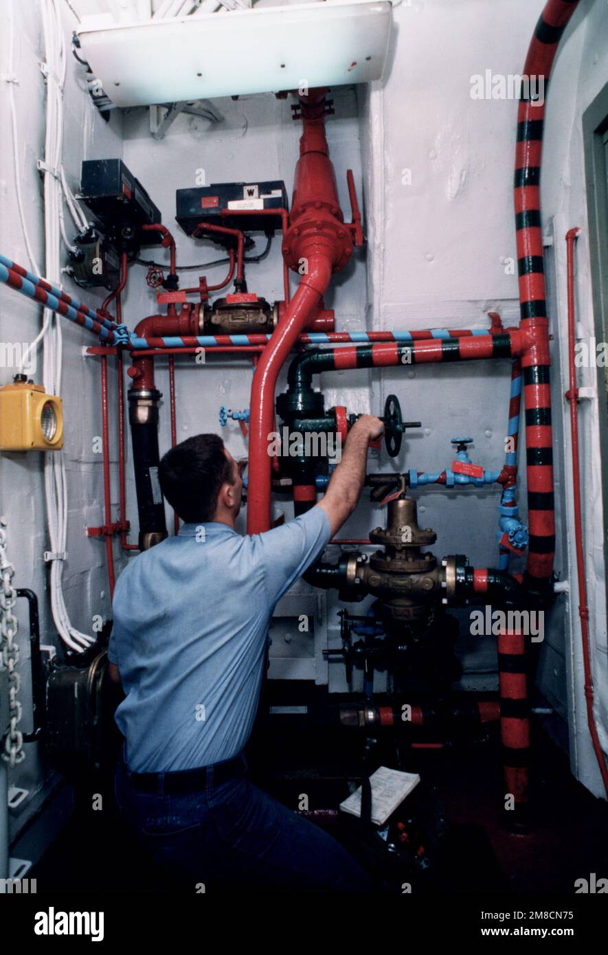 Damage Controlman/Fireman Carden, a crew member aboard the guided ...