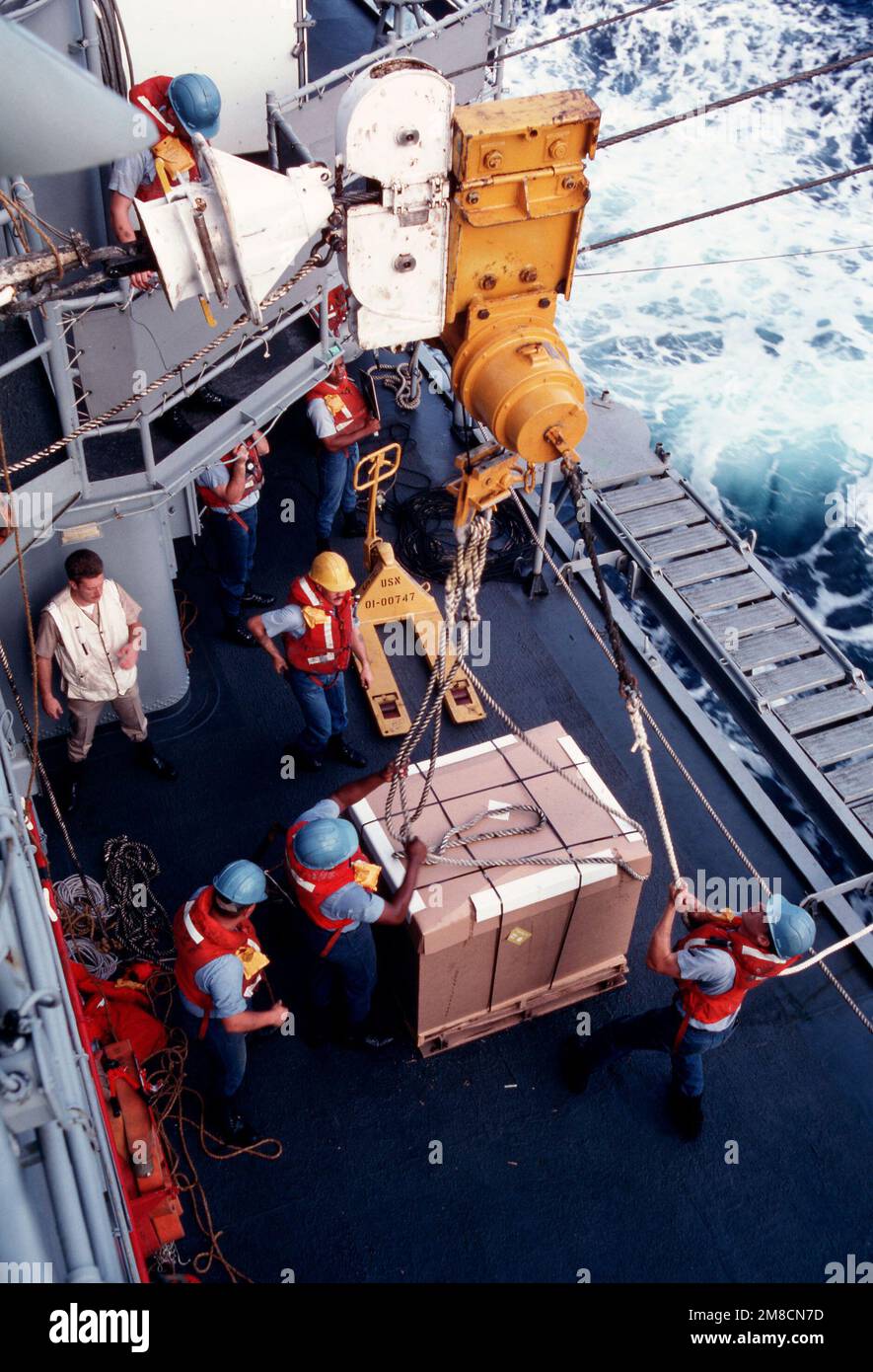 Crew members aboard the guided missile cruiser USS JOSEPHUS DANIELS (CG ...