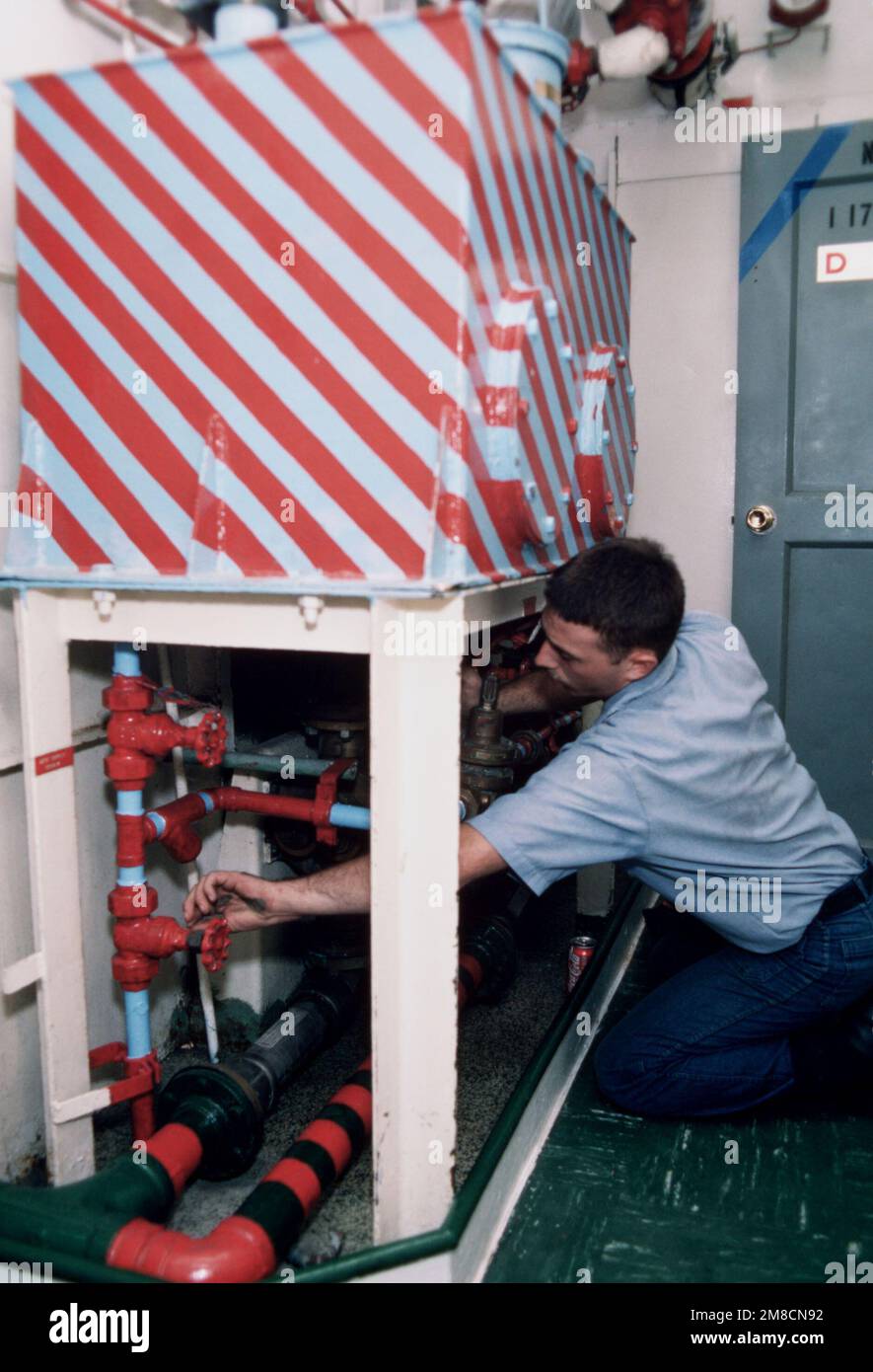 Damage Controlman/Fireman Carden, a crew member aboard the guided ...