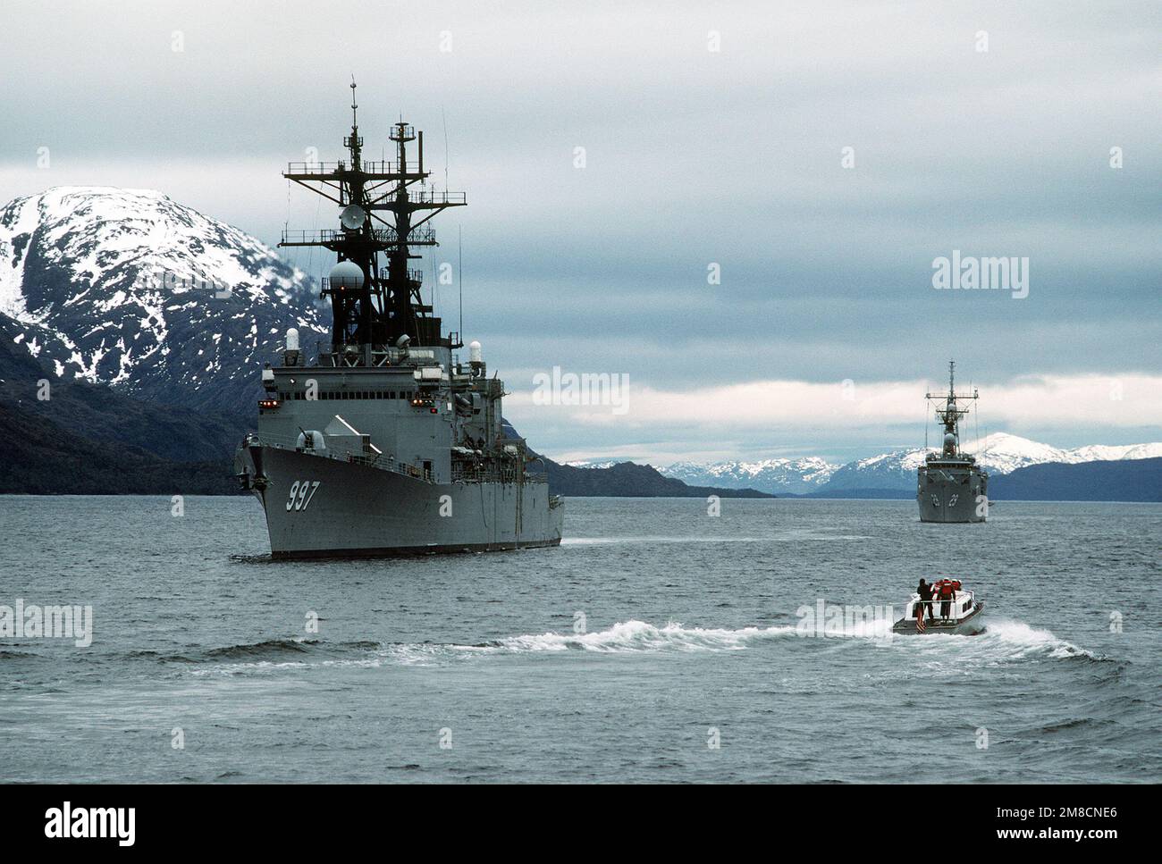 The gig of the destroyer USS HAYLER (DD-997) travels between the HAYLER ...