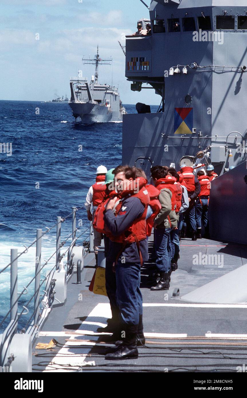 Crew members aboard the guided missile cruiser USS JOSEPHUS DANIELS (CG ...
