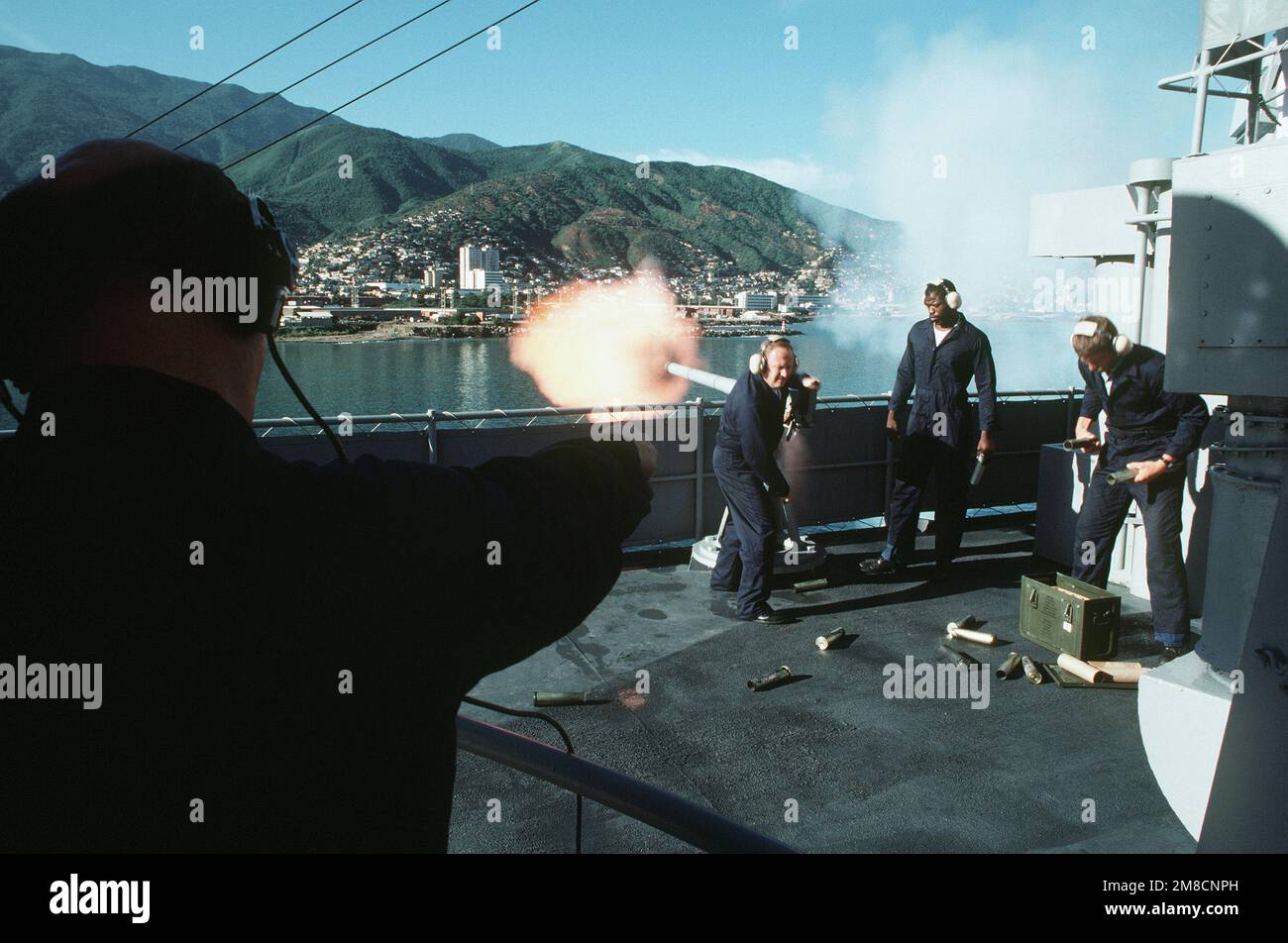 A crew member aboard the guided missile cruiser USS JOSEPHUS DANIELS ...